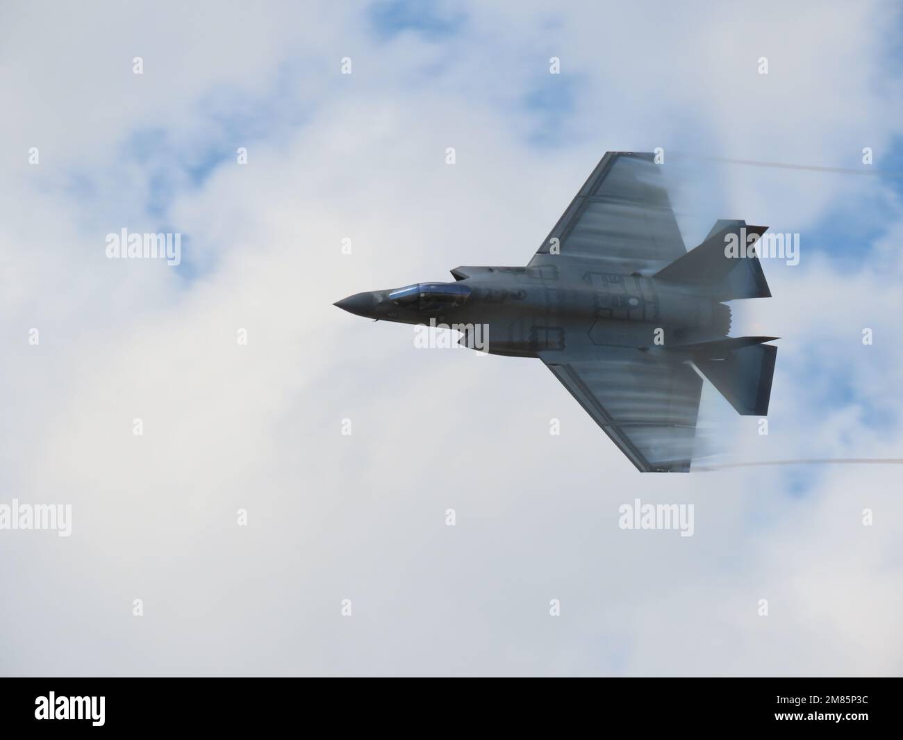 A low angle shot of a F-35 Lightning 2 plane flying at a show Stock ...