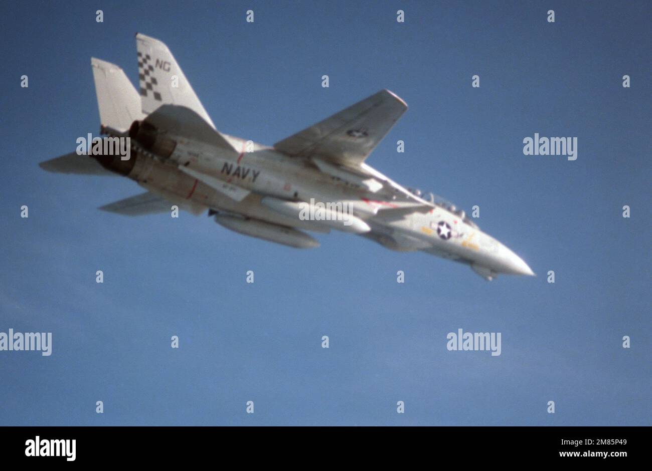 An air-to-air right underside view of a Fighter Squadron 211 (VF-211) F ...