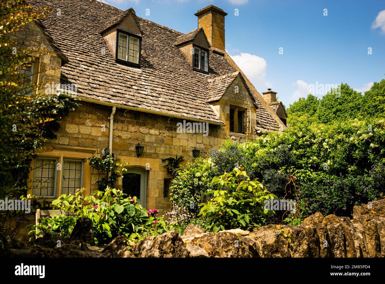 Arched entrace and mullioned windows in the Cotswold Village of Stanton ...