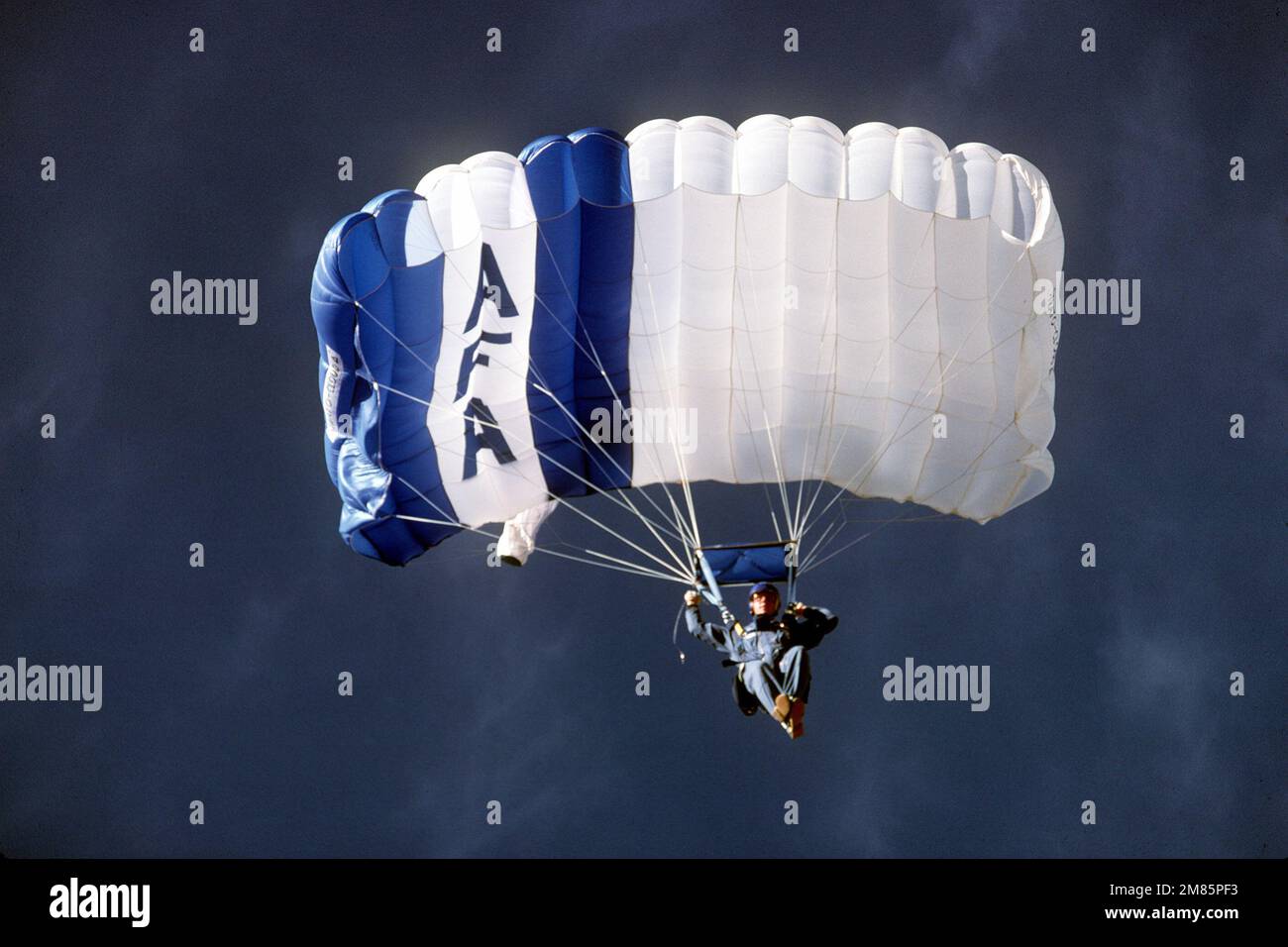 A cadet glides toward a target during a demonstration jump by the U.S ...