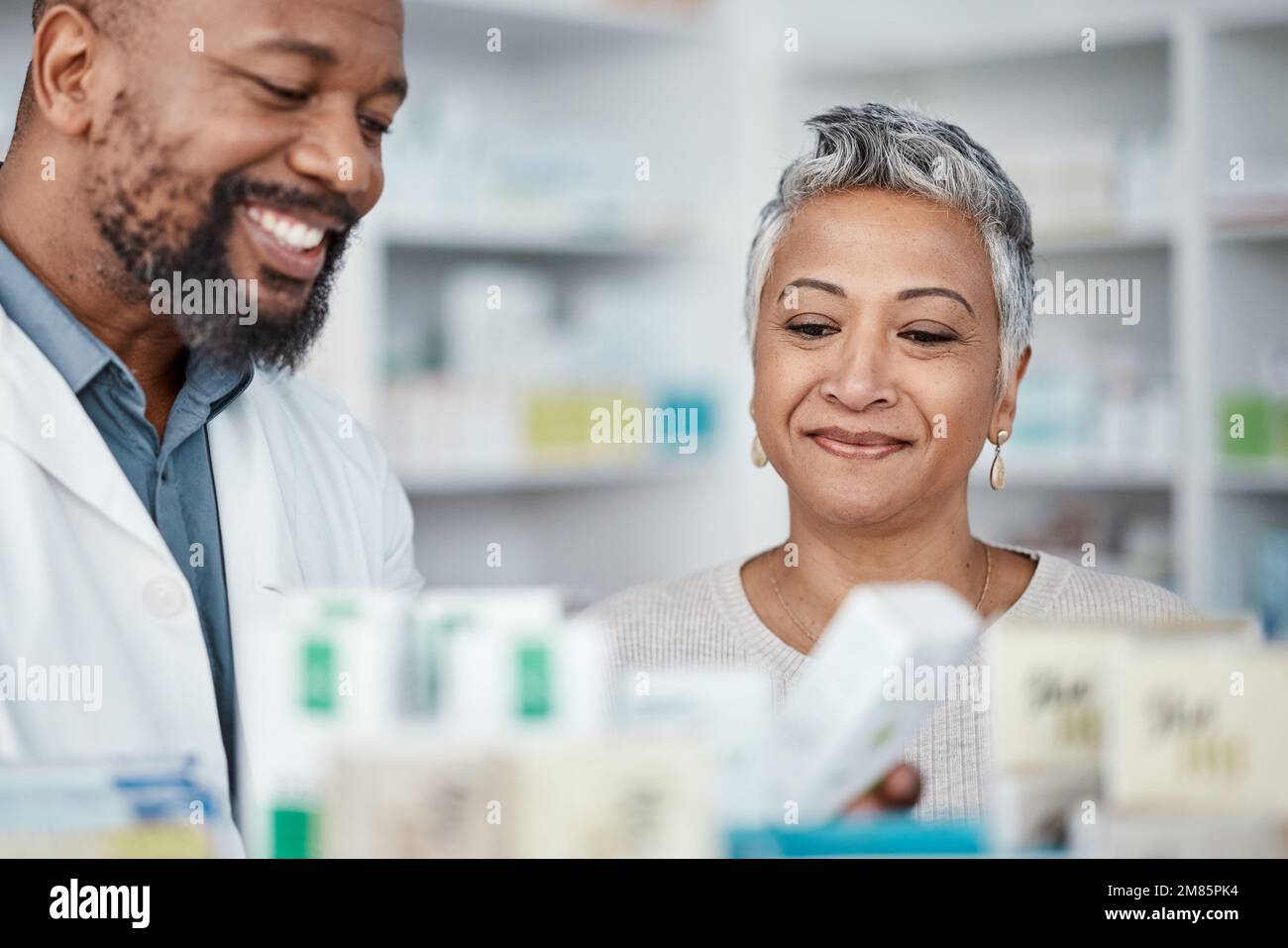 Pharmacy, medicine and senior woman consulting pharmacist on ...