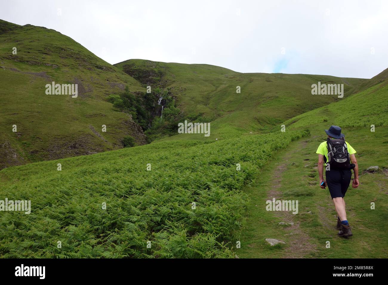 Man Walking on a Path to Cautley Spout Waterfall & Crag in the Howgill ...