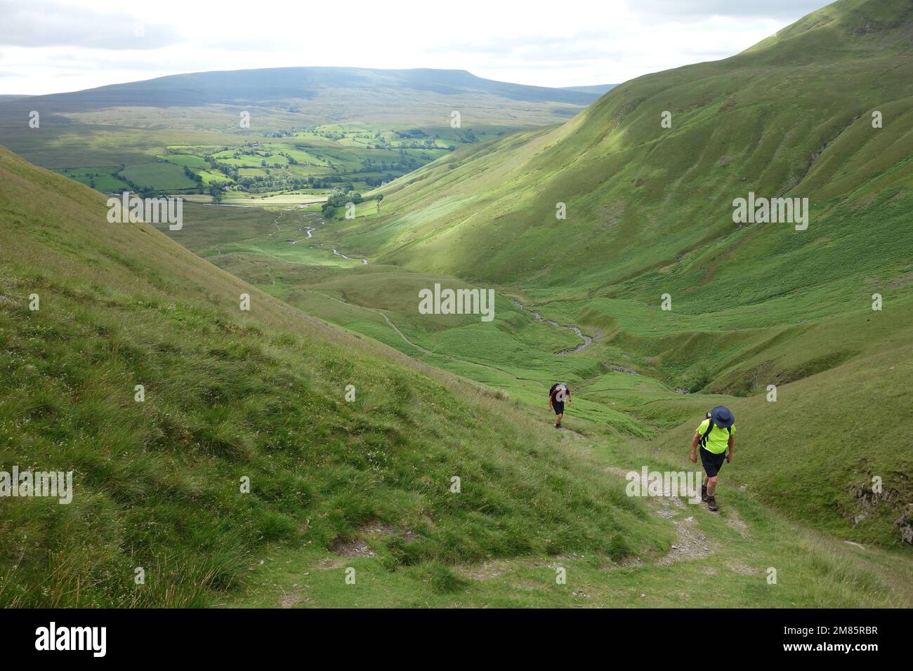 Two Men Walking on Path by Cautley Spout Waterfall & Crag in the ...