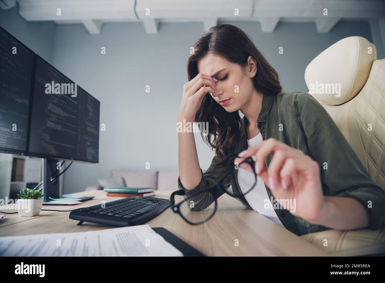 Photo of stressed depressed sad lady site developer suffer headache hard work day overwhelmed ...