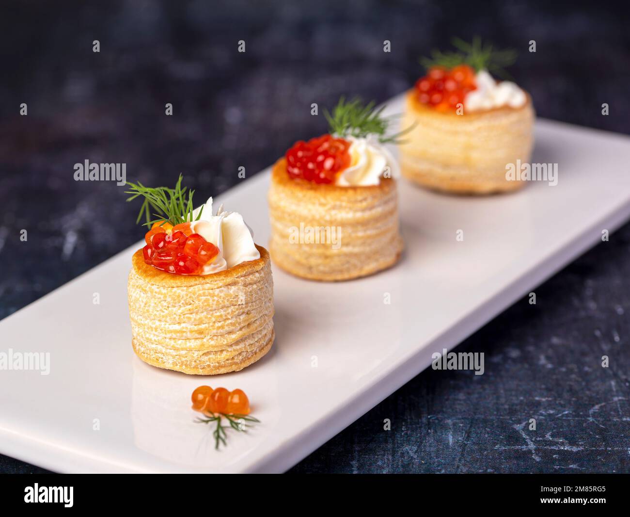 Food photography of starter with caviar, cream, dill, snack, seafood ...