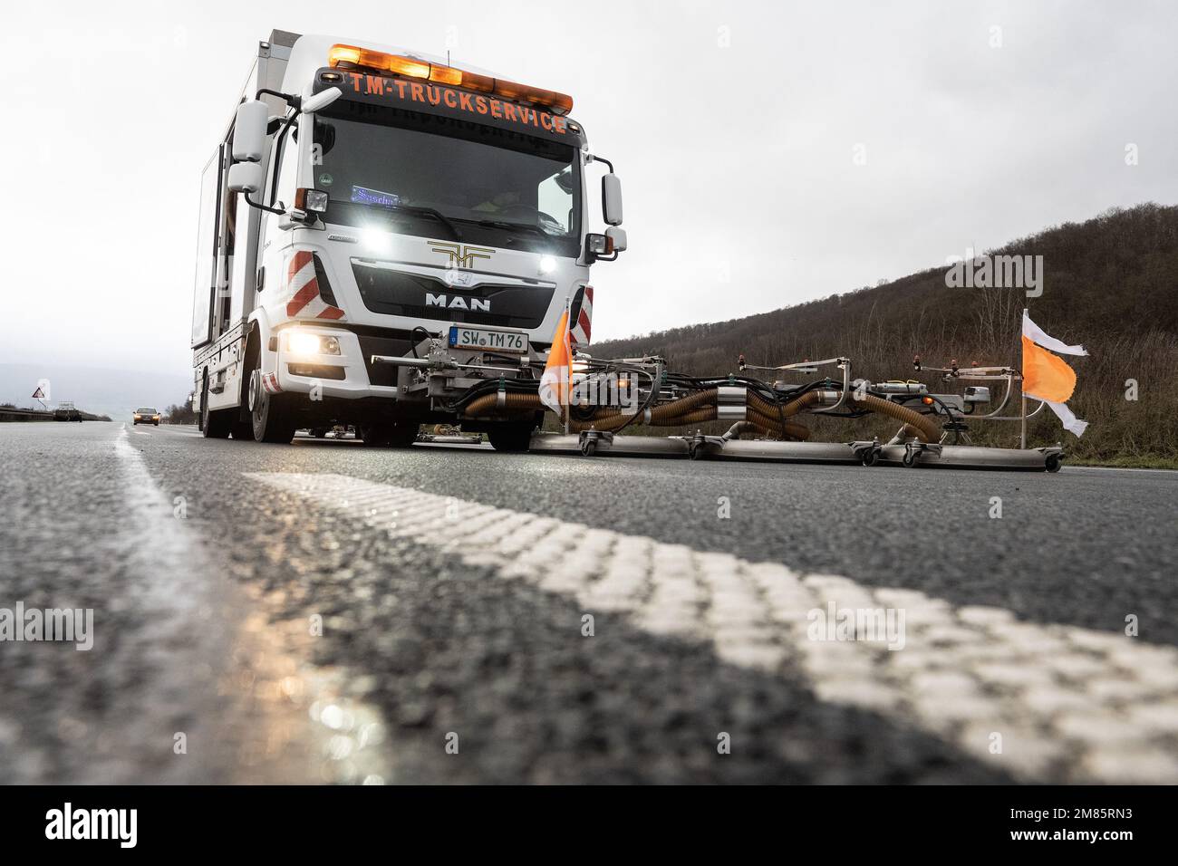 12 January 2023, Lower Saxony, Hedemünden: Special vehicles clean the ...