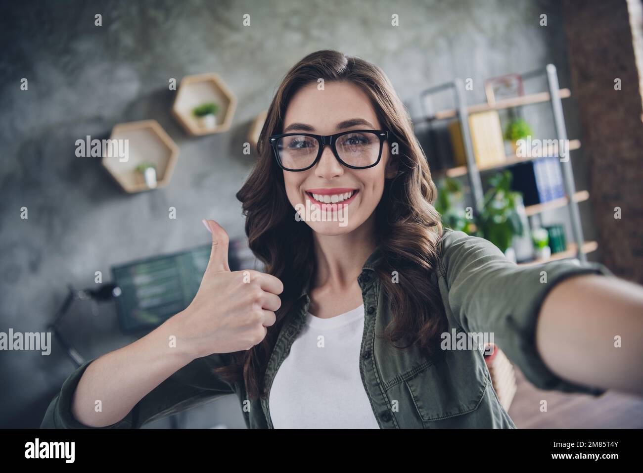 Photo of cheerful successful digital marketing expert take selfie hand ...
