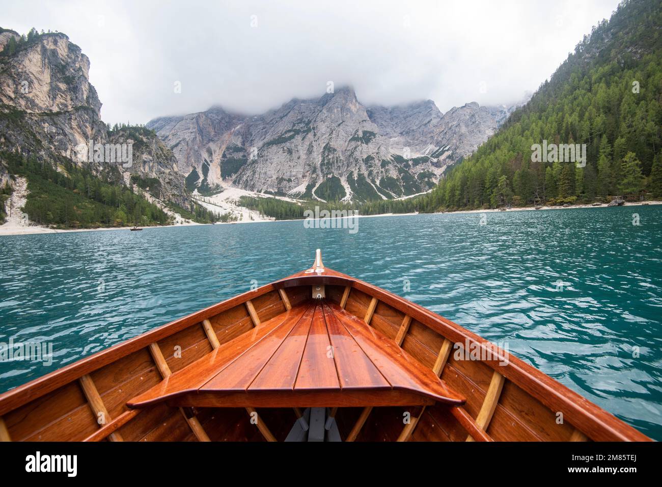Wooden rowing boats for hire on Lago di Braies in the Dolomites, Italy ...