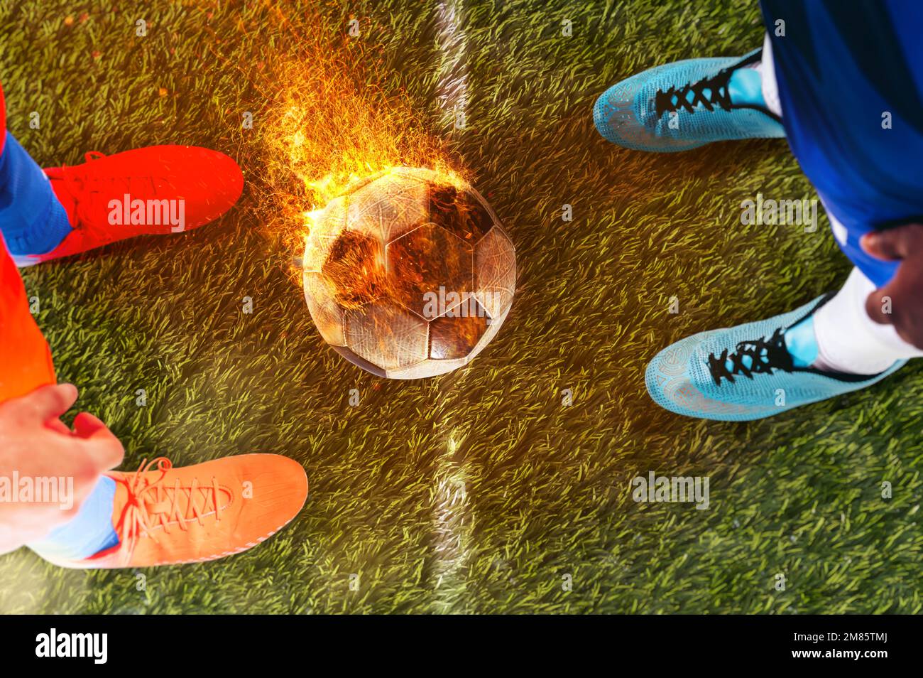 Two soccer players challenge each other at the stadium ready to kick a ...