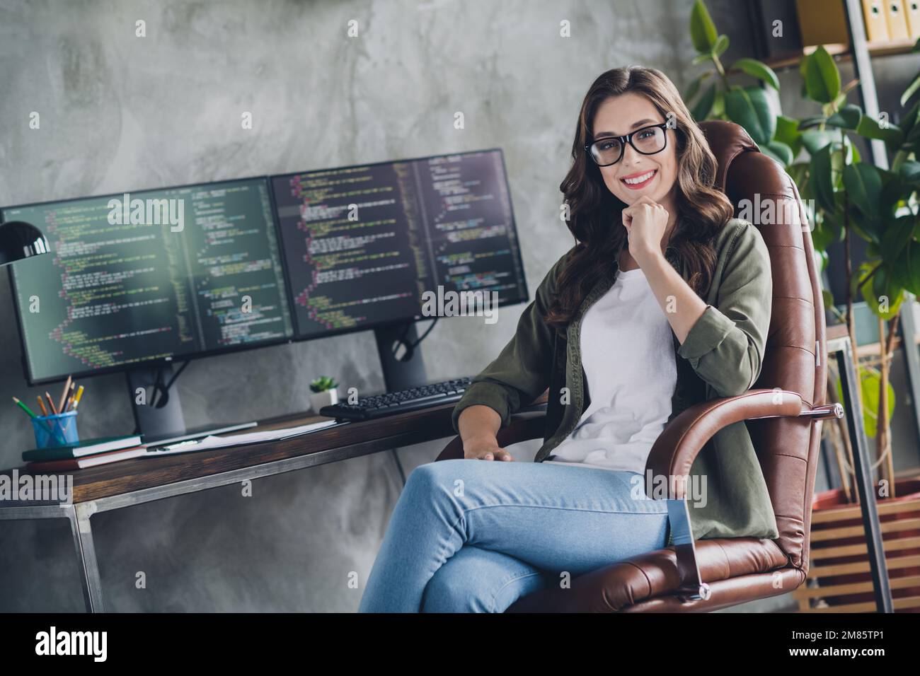Photo of clever minded pc operator girl sitting chair hand touch chin ...