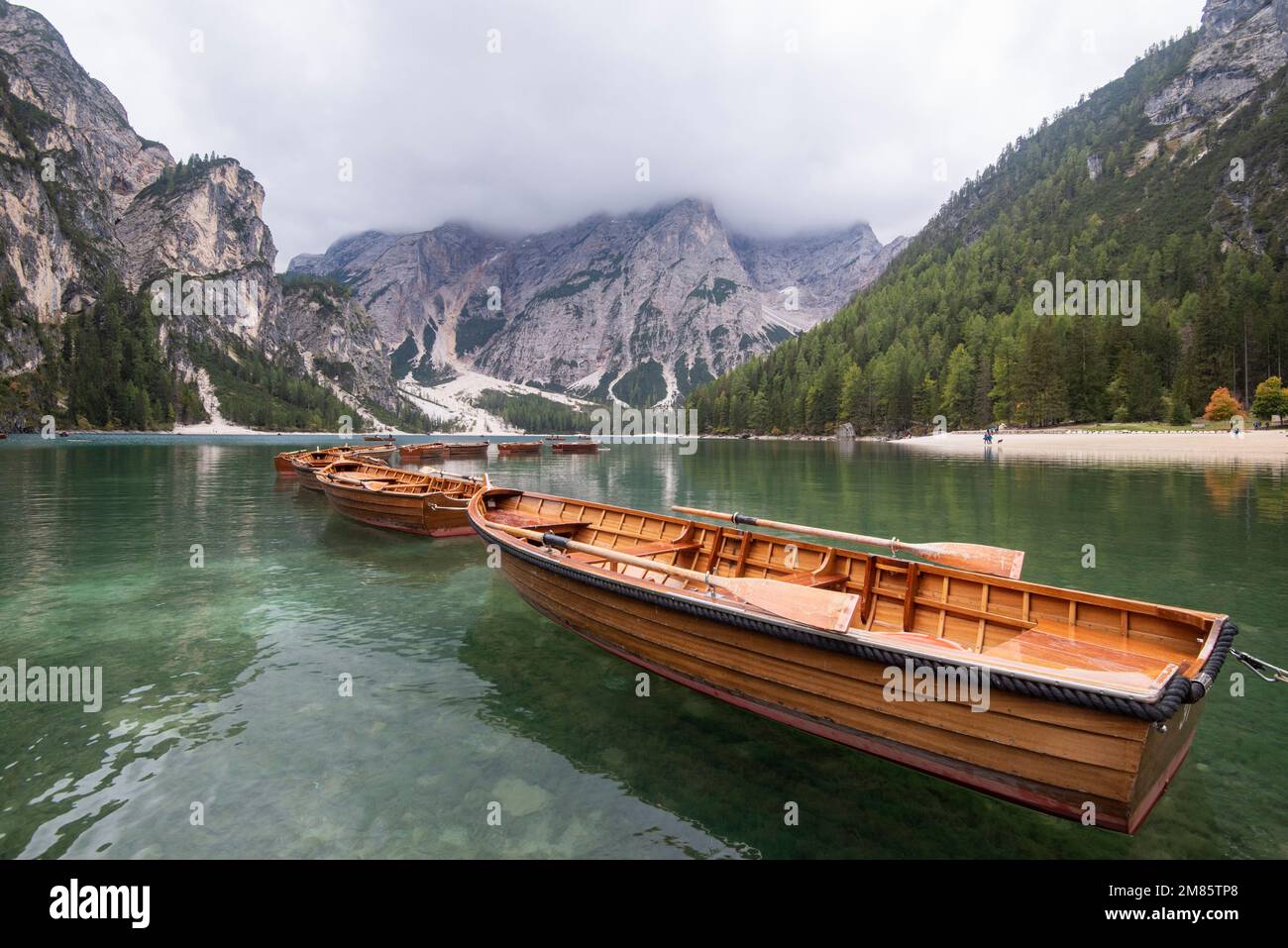 Wooden rowing boats for hire on Lago di Braies in the Dolomites, Italy ...