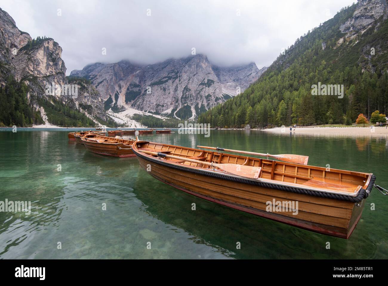 Wooden rowing boats for hire on Lago di Braies in the Dolomites, Italy ...