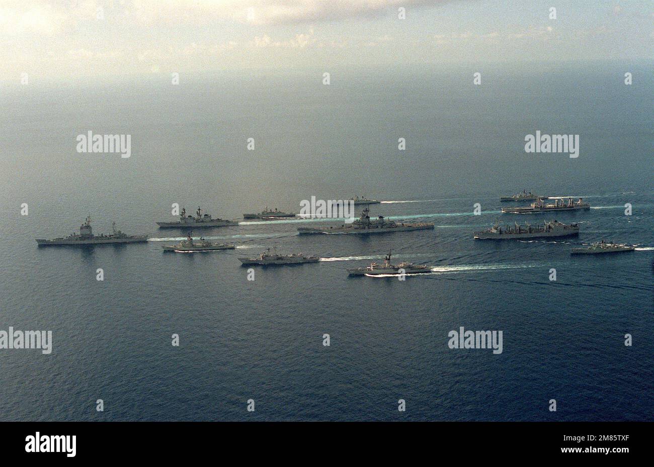 An aerial port beam view of the first battleship battle group to deploy ...