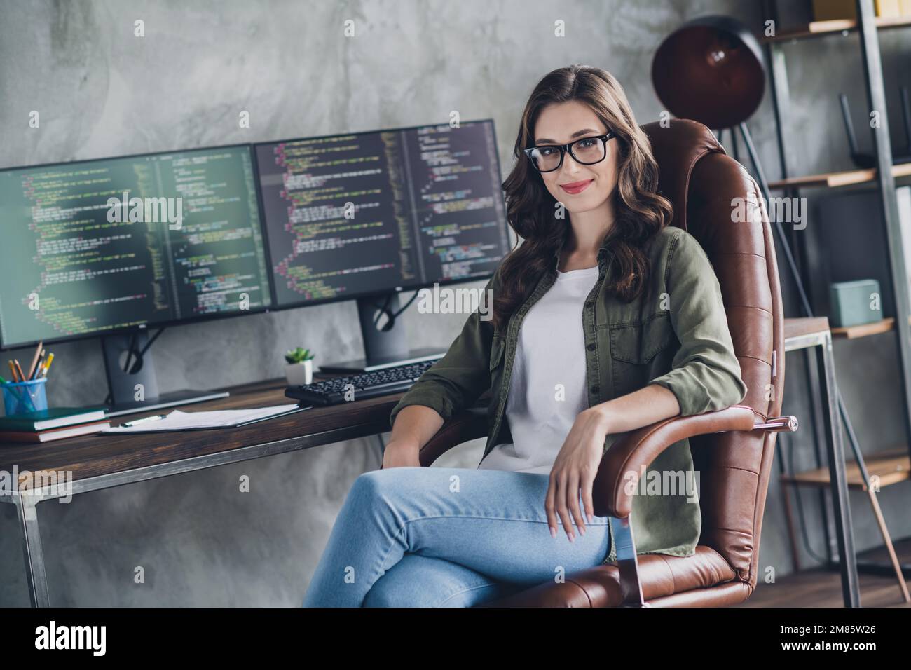 Portrait of intelligent positive person pc operator sitting chair ...