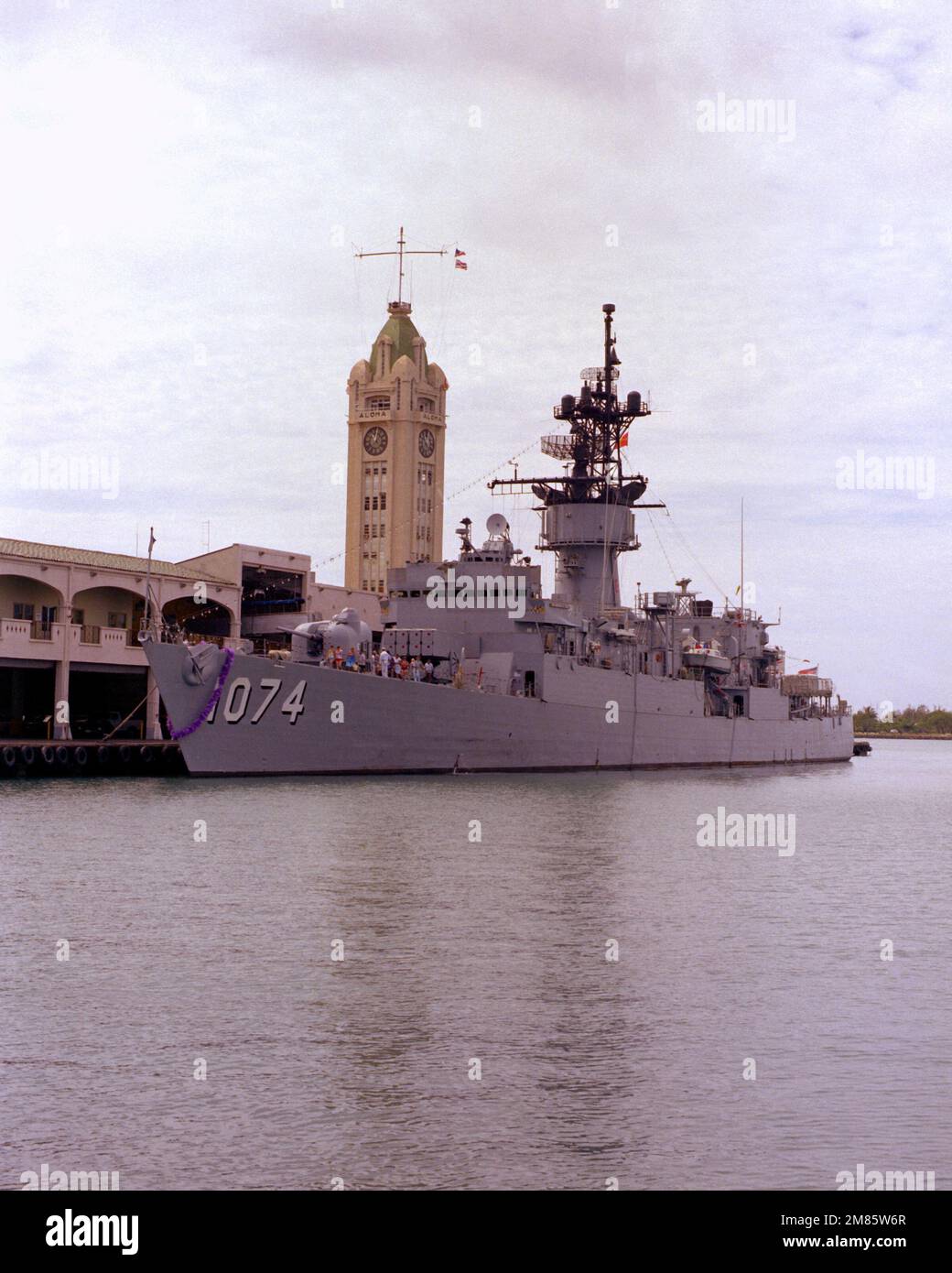 A port bow view of the frigate USS HAROLD E. HOLT (FF-1074) in port ...
