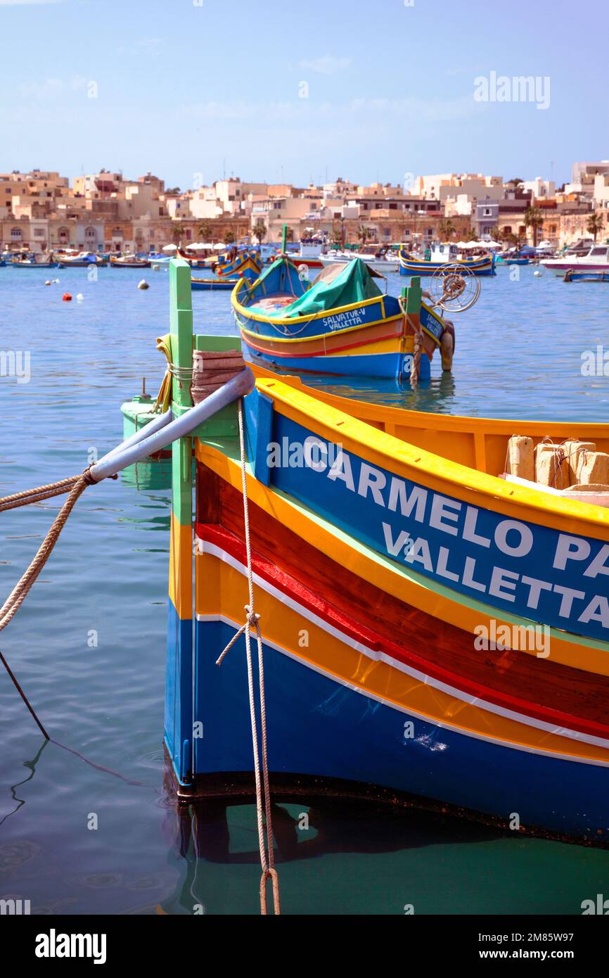 Luzzus, the typical colorful fishing boats of Malta, in the harbor of ...