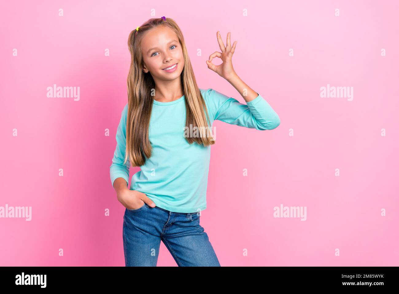 Photo of cheerful cute schoolchild hand fingers demonstrate okey symbol ...