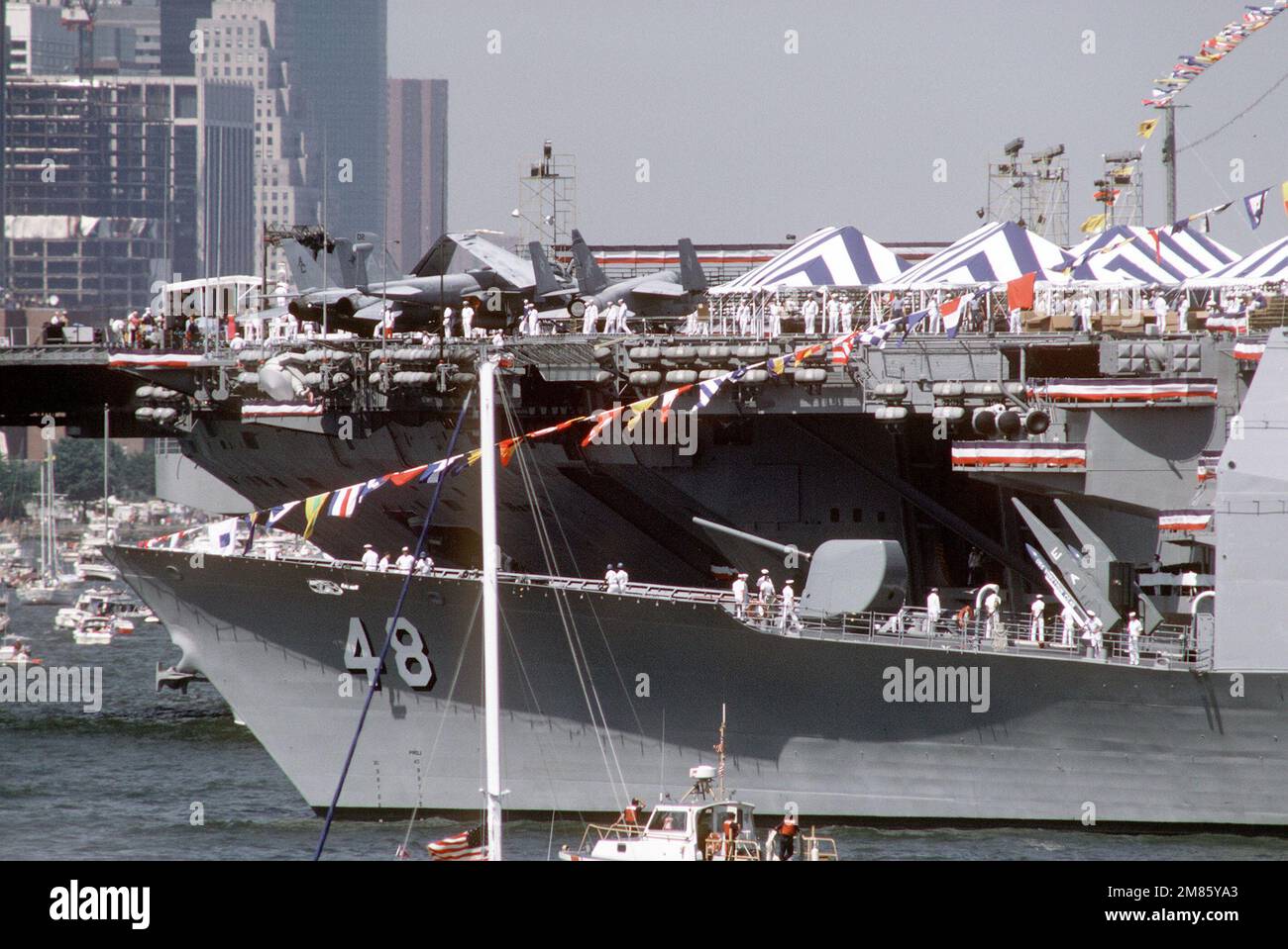 A view of the aircraft carrier USS JOHN F. KENNEDY (CV-67), background ...
