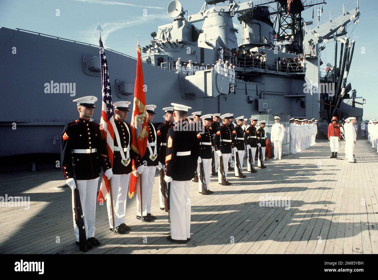 A U.S. Marine Corps honor guard stands in formation aboard the ...