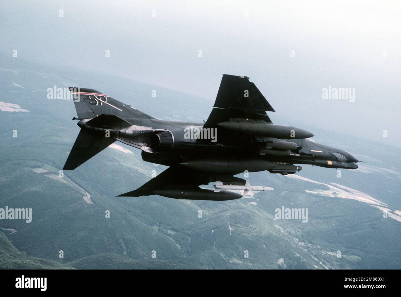 An air-to-air right underside view of a 52nd Tactical Fighter Wing F-4G ...