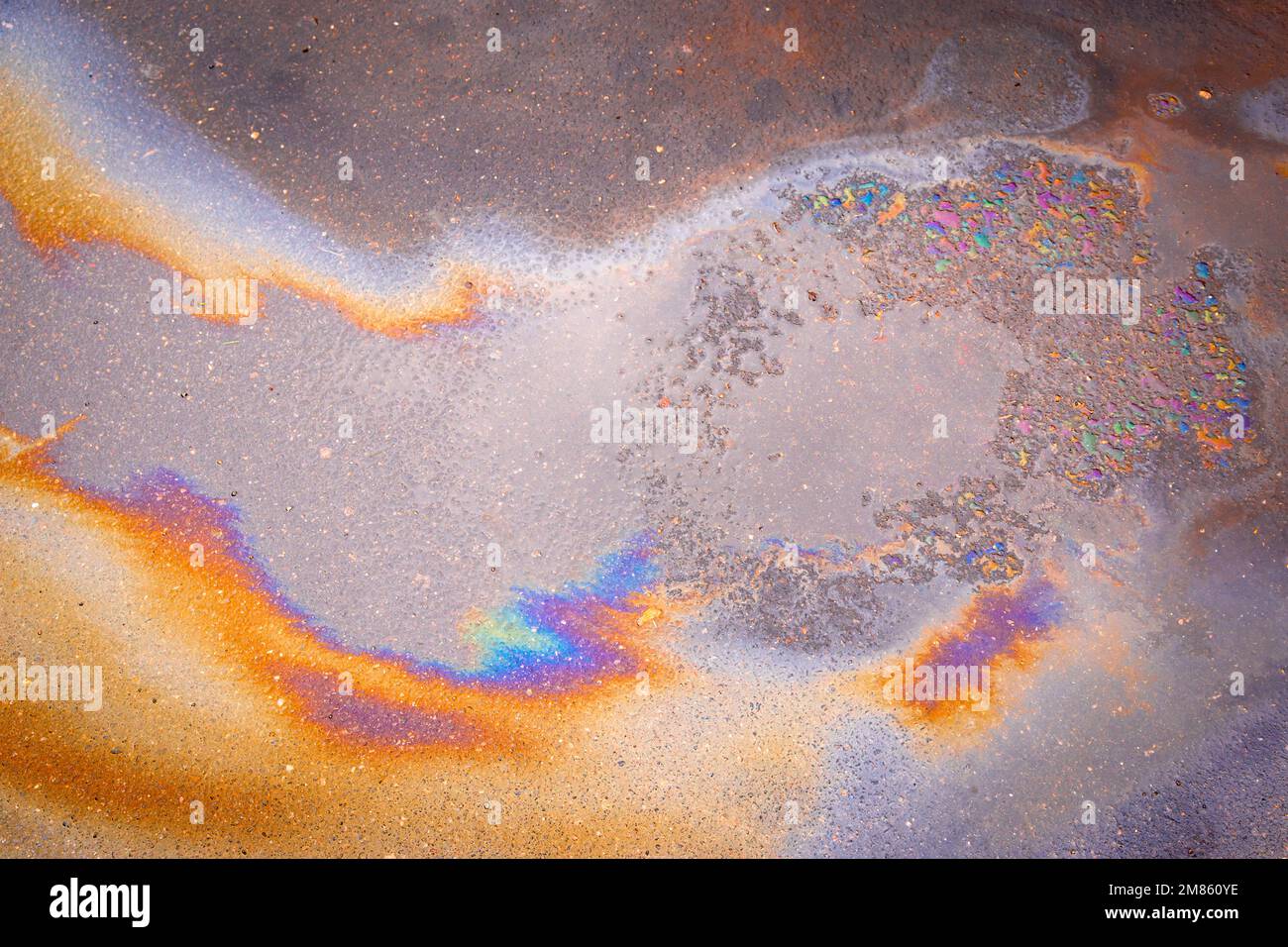 Spills of fuel or oil on the asphalt road as texture or background ...