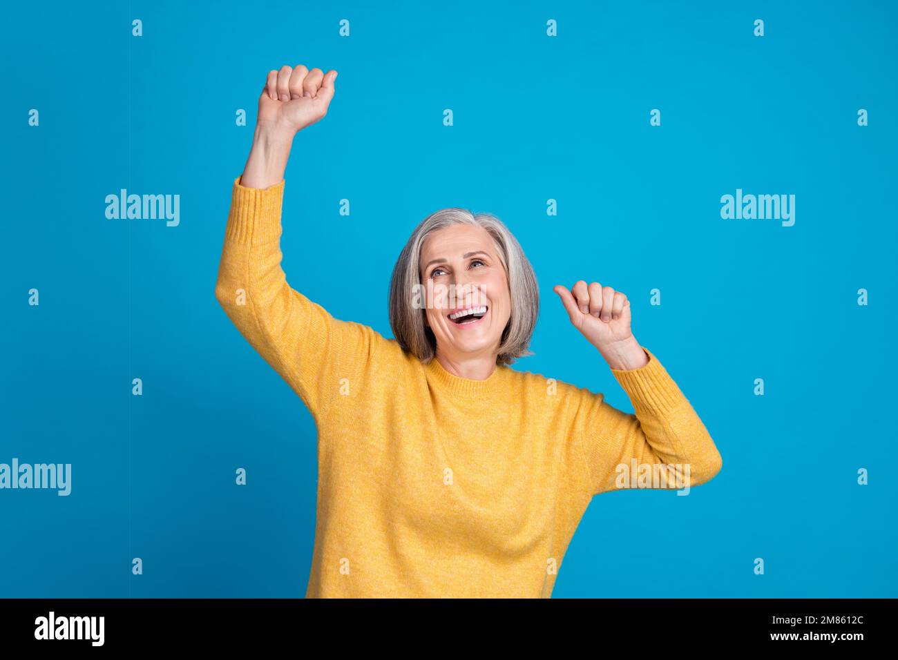 Photo portrait of senior gorgeous woman raise fists celebrate win ...