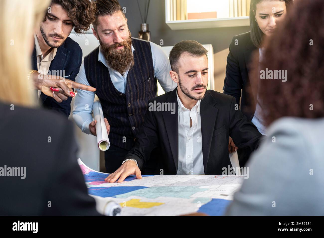 Multicultural business people working together on sustainable ...