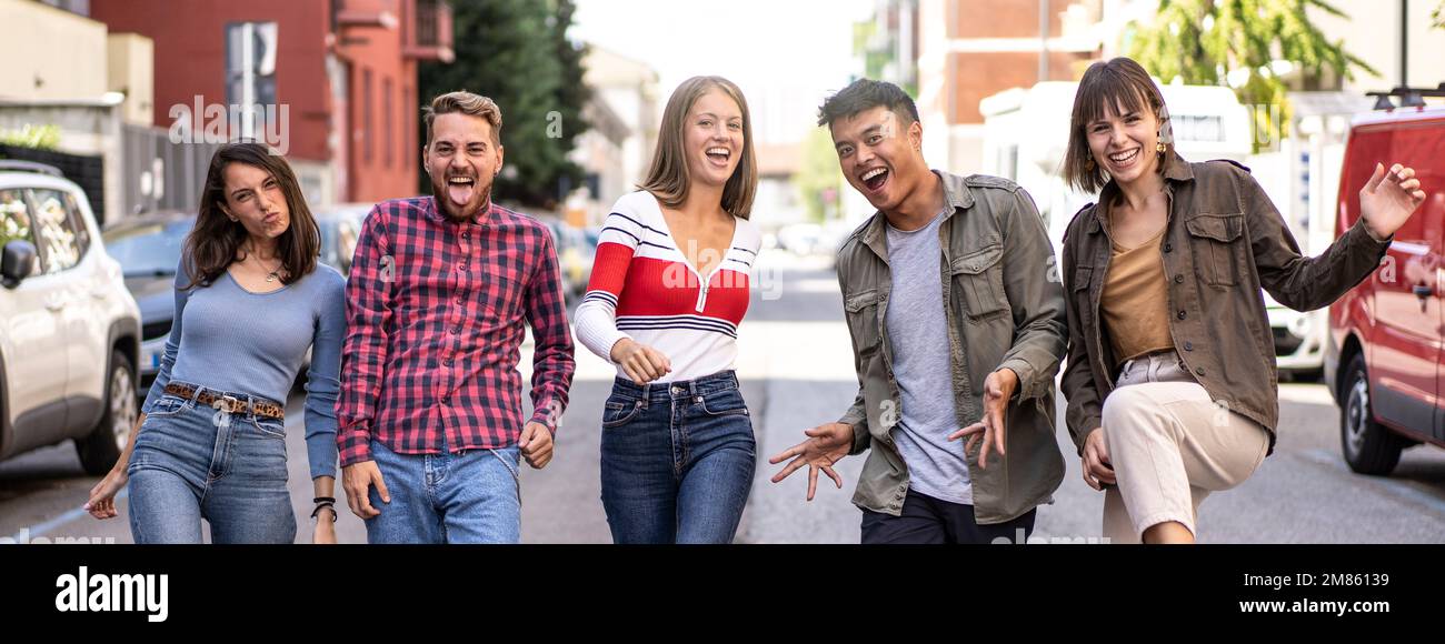 Horizontal banner or header with multicultural friends walking at city ...