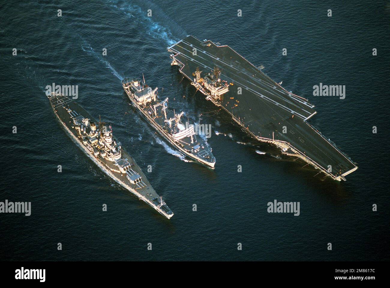 An overhead view of the fleet oiler USNS KAWISHIWI (T-AO-146), center ...