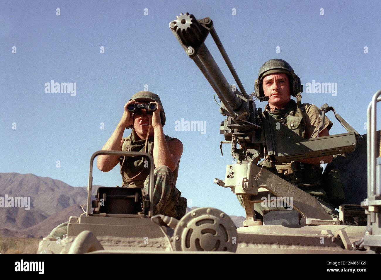 A member of the 197th Infantry Brigade (Mechanized) searches for ...