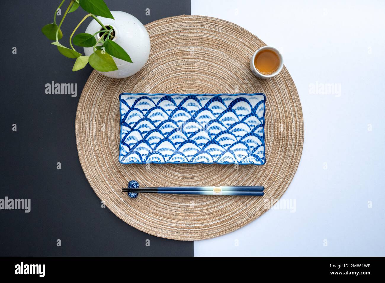 Japanese or Chinese table setting with traditional table mat and ...