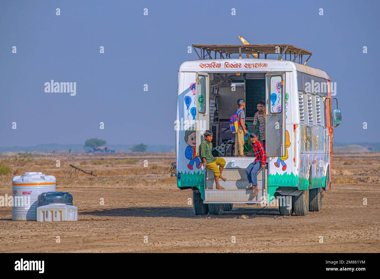 A Mobile primary school made in old bus in interior of desert Stock ...