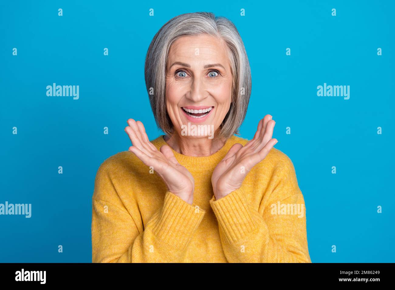 Photo portrait of stunning grandma look raise arms impressed good news ...