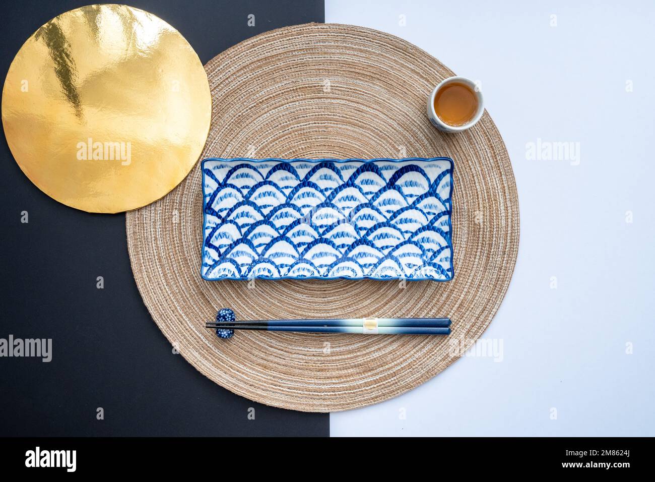 Japanese or Chinese table setting with traditional table mat and ...