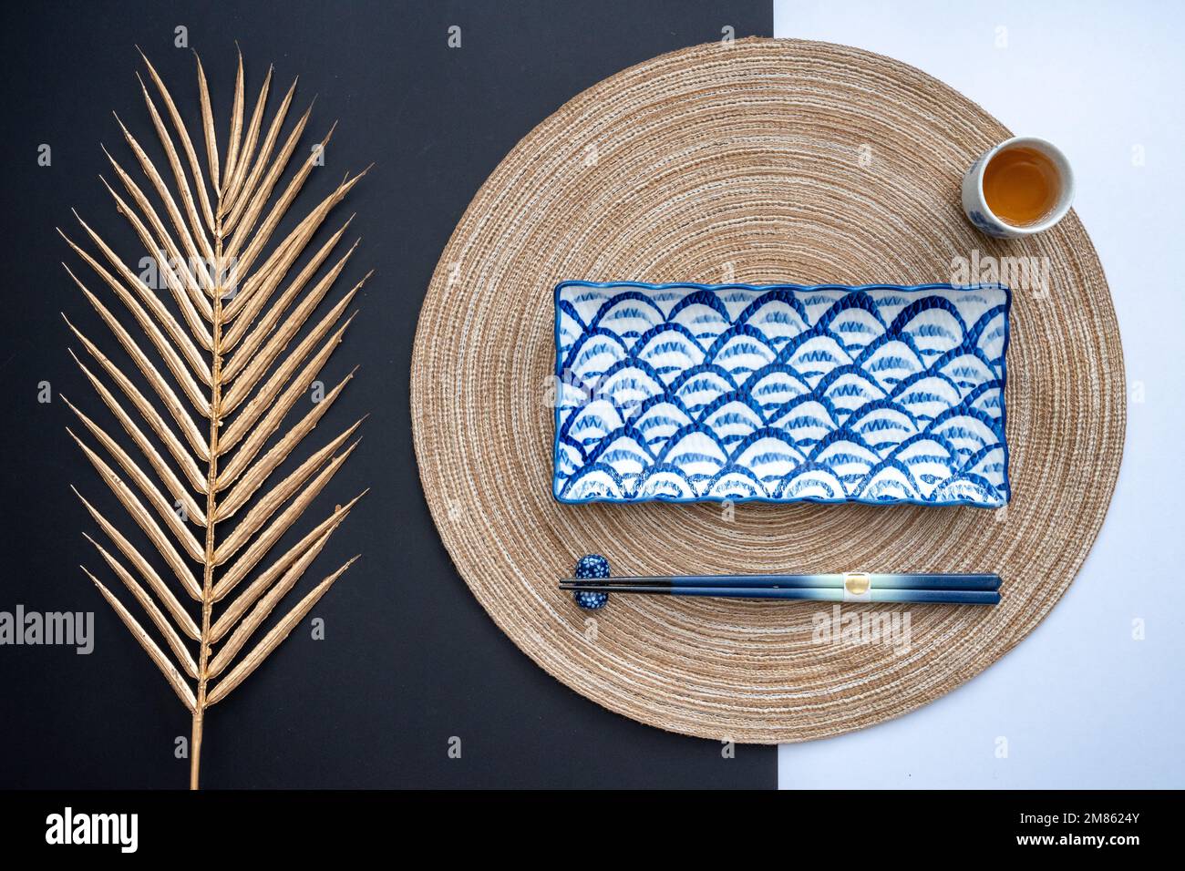 Japanese or Chinese table setting with traditional table mat and ...