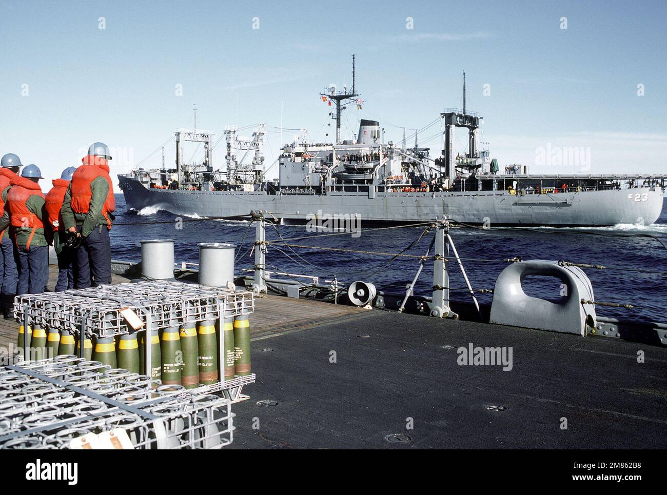 Crewmen aboard the battleship USS IOWA (BB-61) stand by to transfer ...