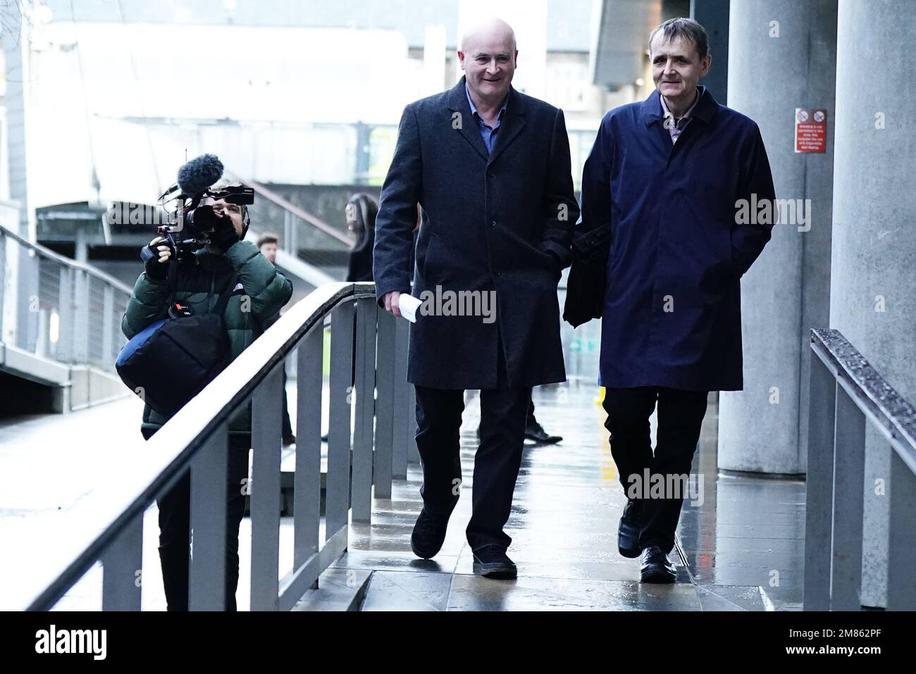 Mick Lynch, general secretary of the Rail, Maritime and Transport union (RMT), with assistant ...