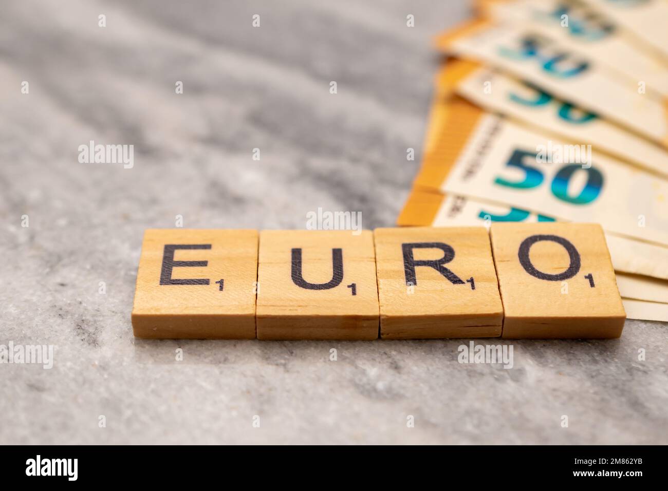 Close-Up Word EURO Is Written In Wooden Letters, Near Part Of 50 Euro ...