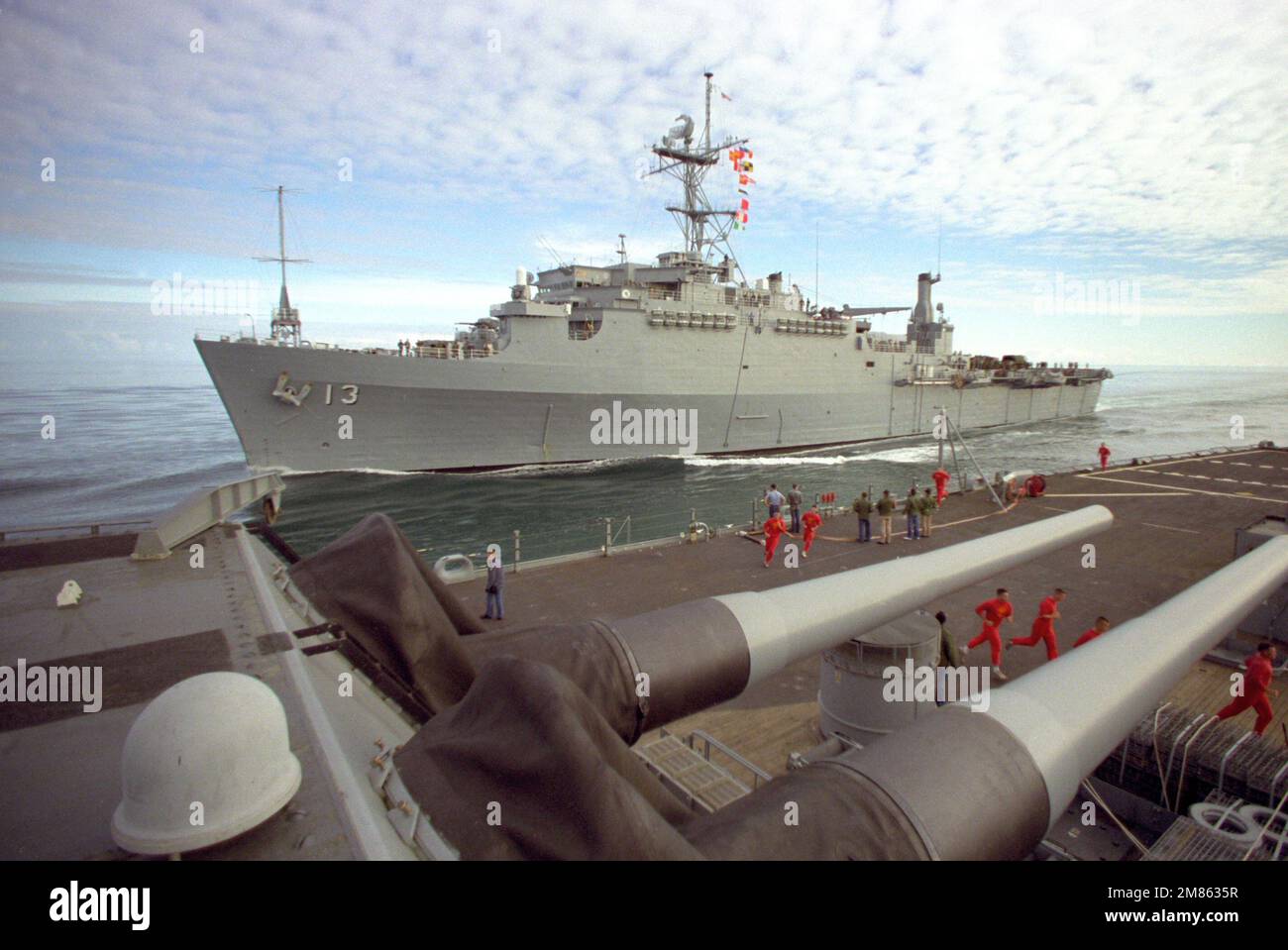 Crew members jog around the fantail of the battleship USS IOWA (BB-61 ...