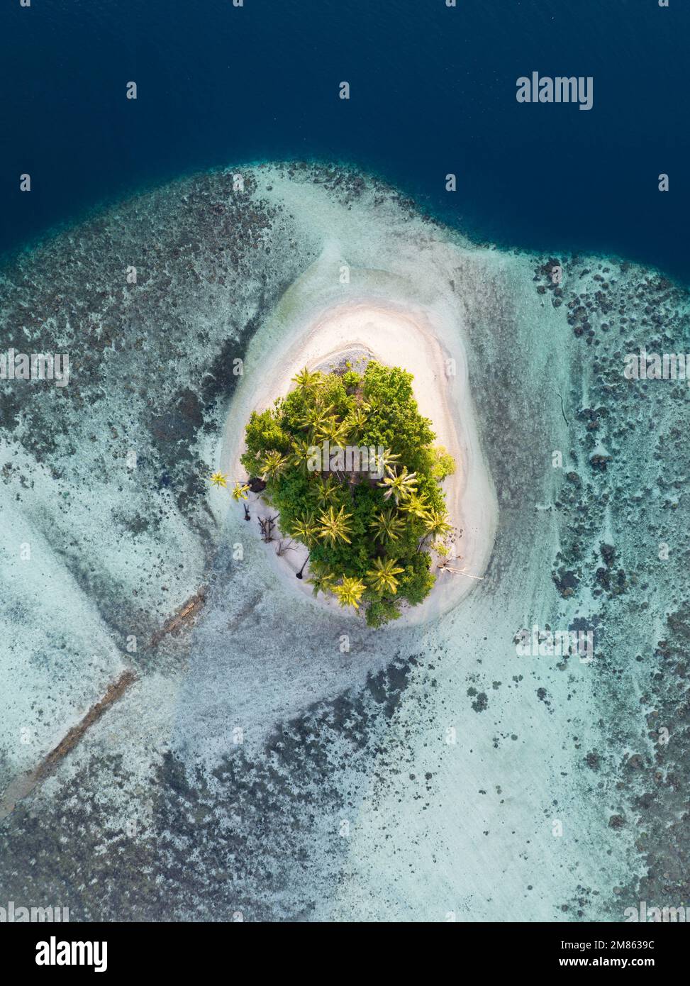 A beautiful coral reef surrounds a scenic island in the Solomon Islands ...