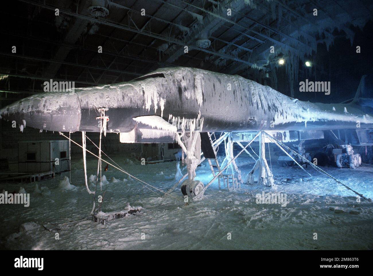 An ice and snow-covered B-1B aircraft undergoes simulated arctic ...