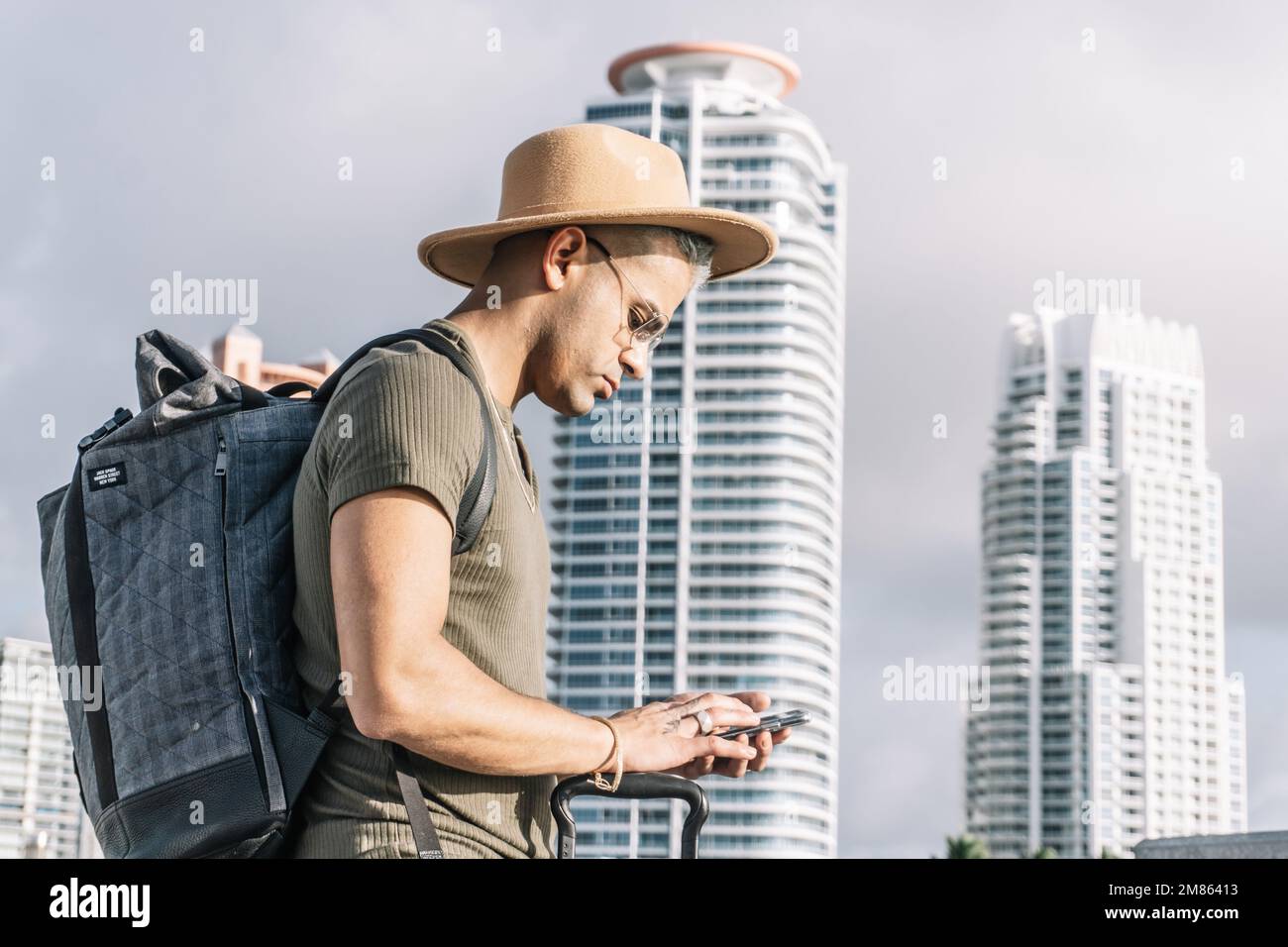Close up, profile of traveller man with a brown hat, looking for ...