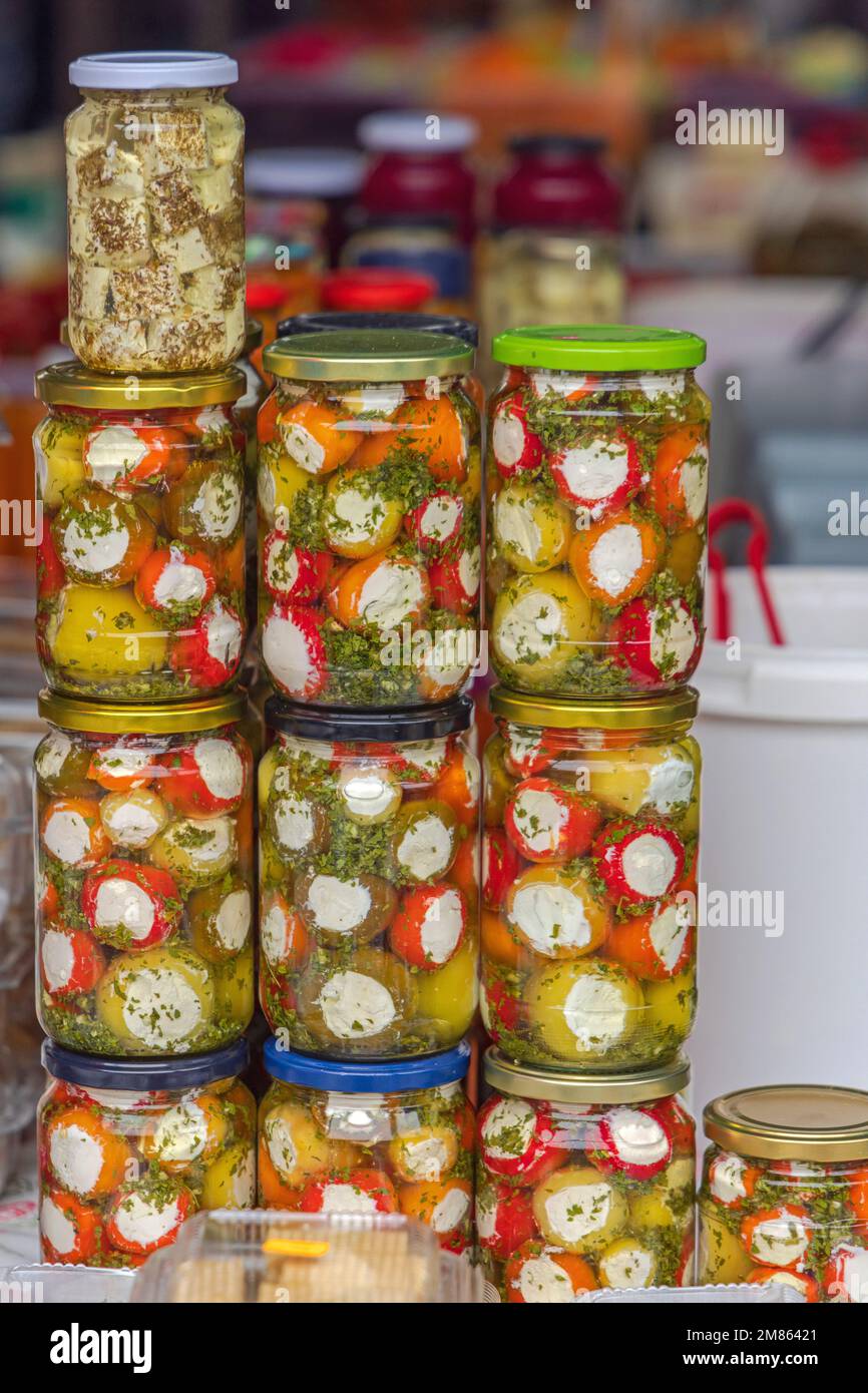 Goat Cheese Stuffed Pickled Peppers in Glass Jars Stock Photo - Alamy