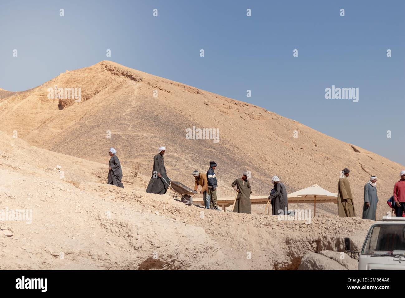 LUXOR, EGYPT - 27 Dec 2022. Group of local arab muslims working in the ...