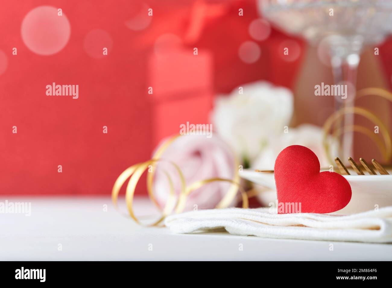 Valentines Day or Romantic dinner concept. Romantic table setting, silverware, wine glasses ...