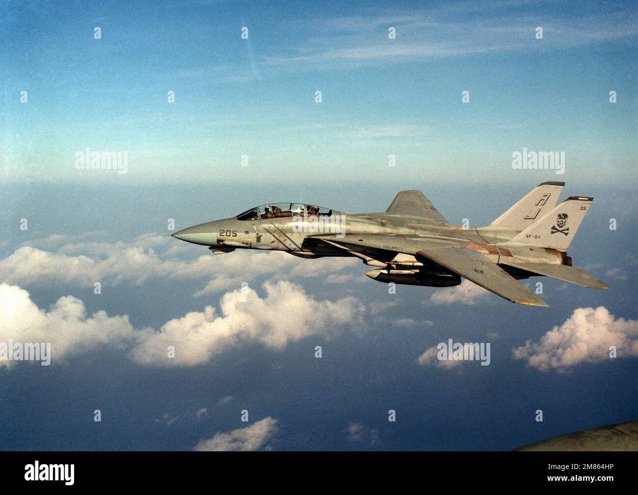 An air-to-air left side view of a Fighter Squadron 84 (VF-84) F-14A ...