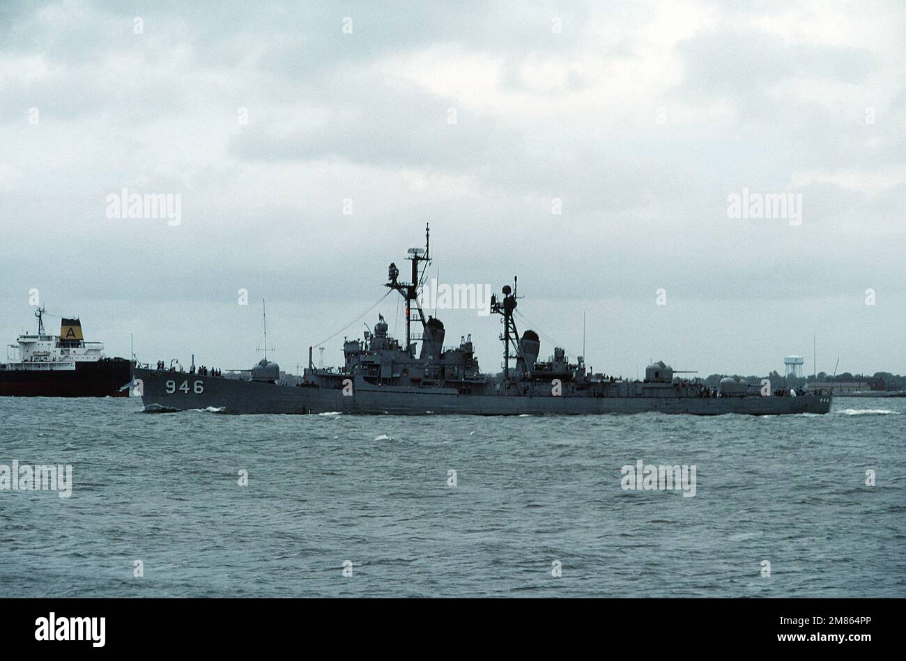A port view of the destroyer USS EDSON (DD-946) underway. The EDSON is ...