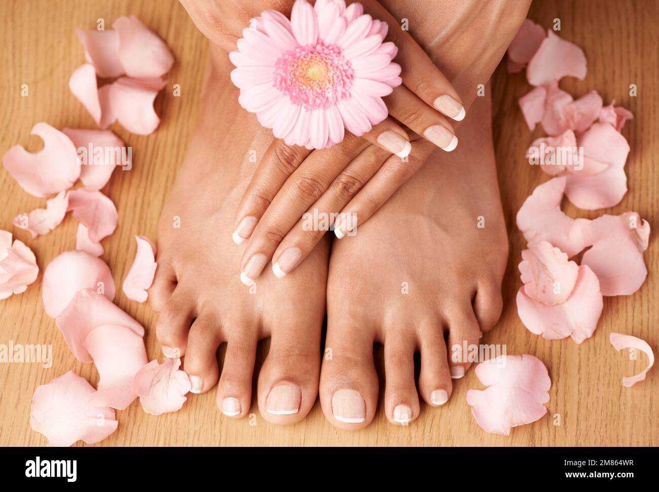 Relax, hands and feet of black woman with flower petals for luxury ...