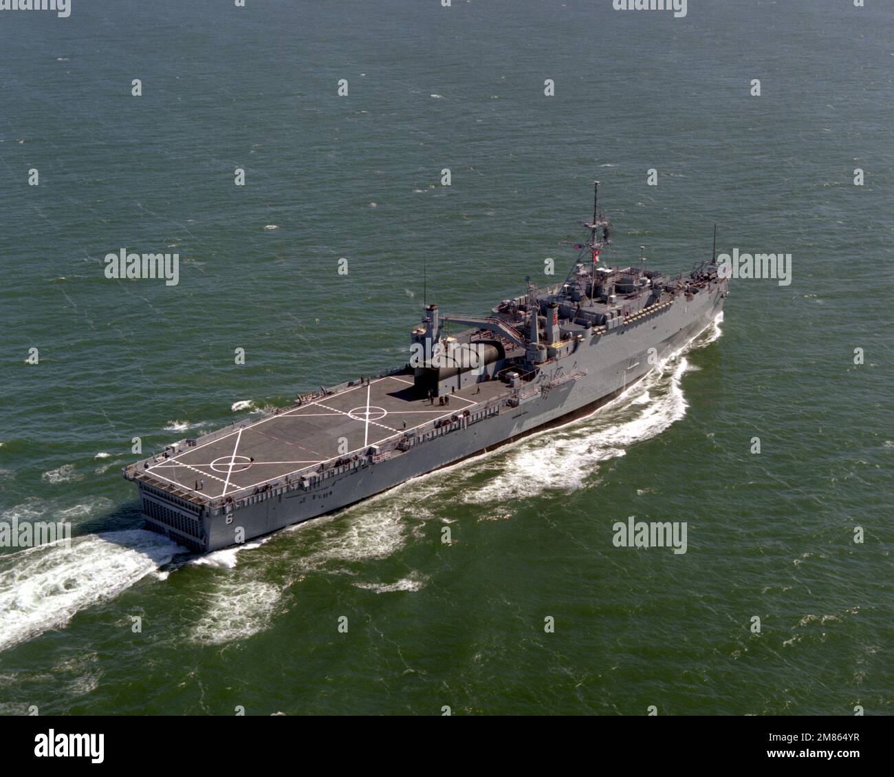 An elevated starboard quarter view of the amphibious transport dock USS ...