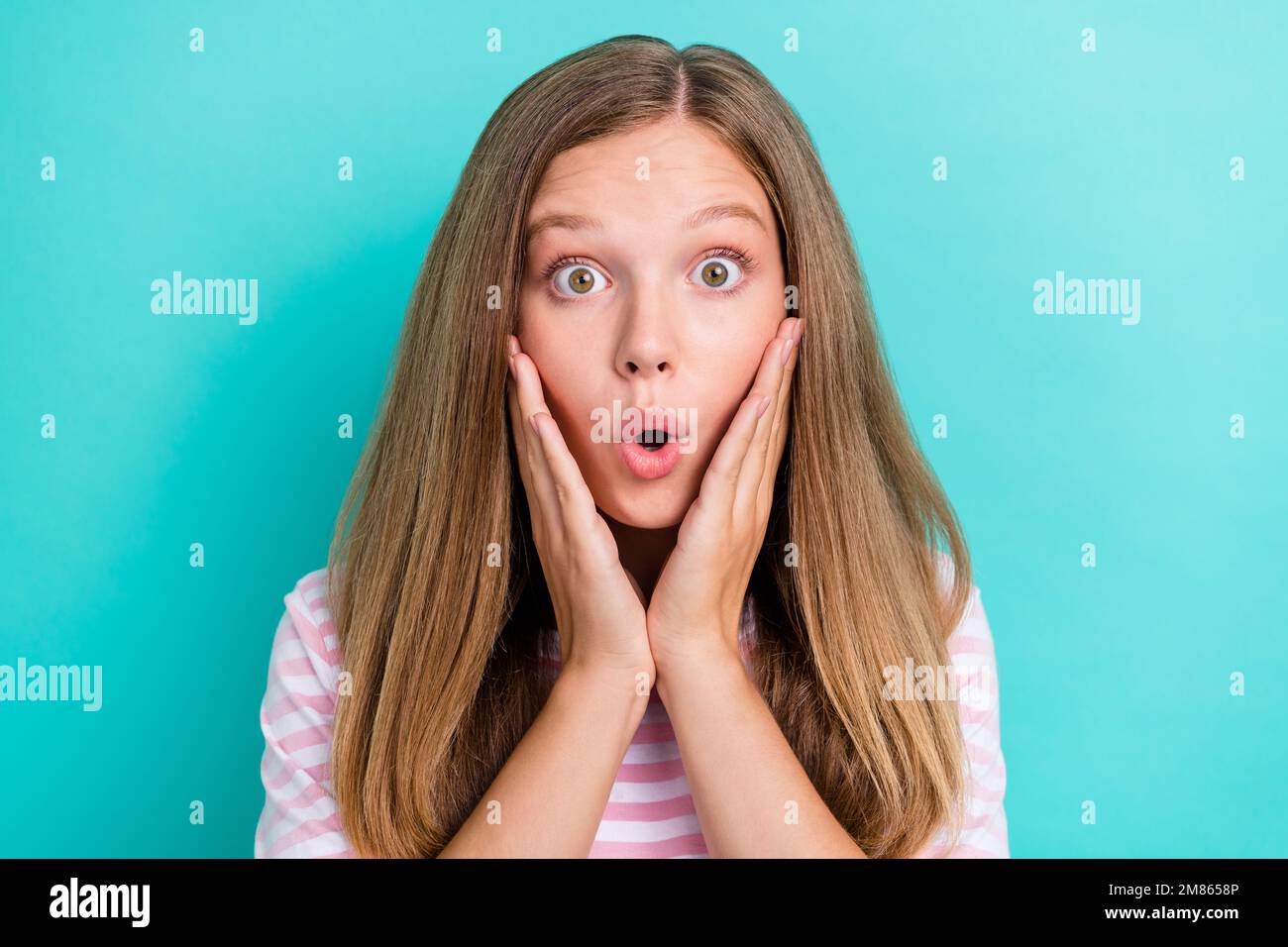 Portrait of impressed shocked person arms touch cheeks pouted lips ...